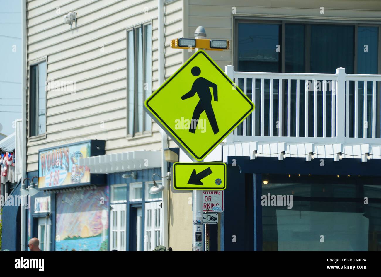 Dewey Beach, Delaware, U.S - July 8, 2023 - A yellow crossing line and blinking lights on the ...