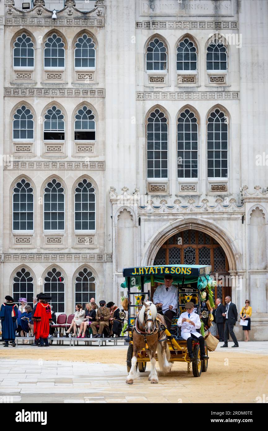 London, UK. 22 July 2023. A horse drawn fruit and vegetable carriage is ...