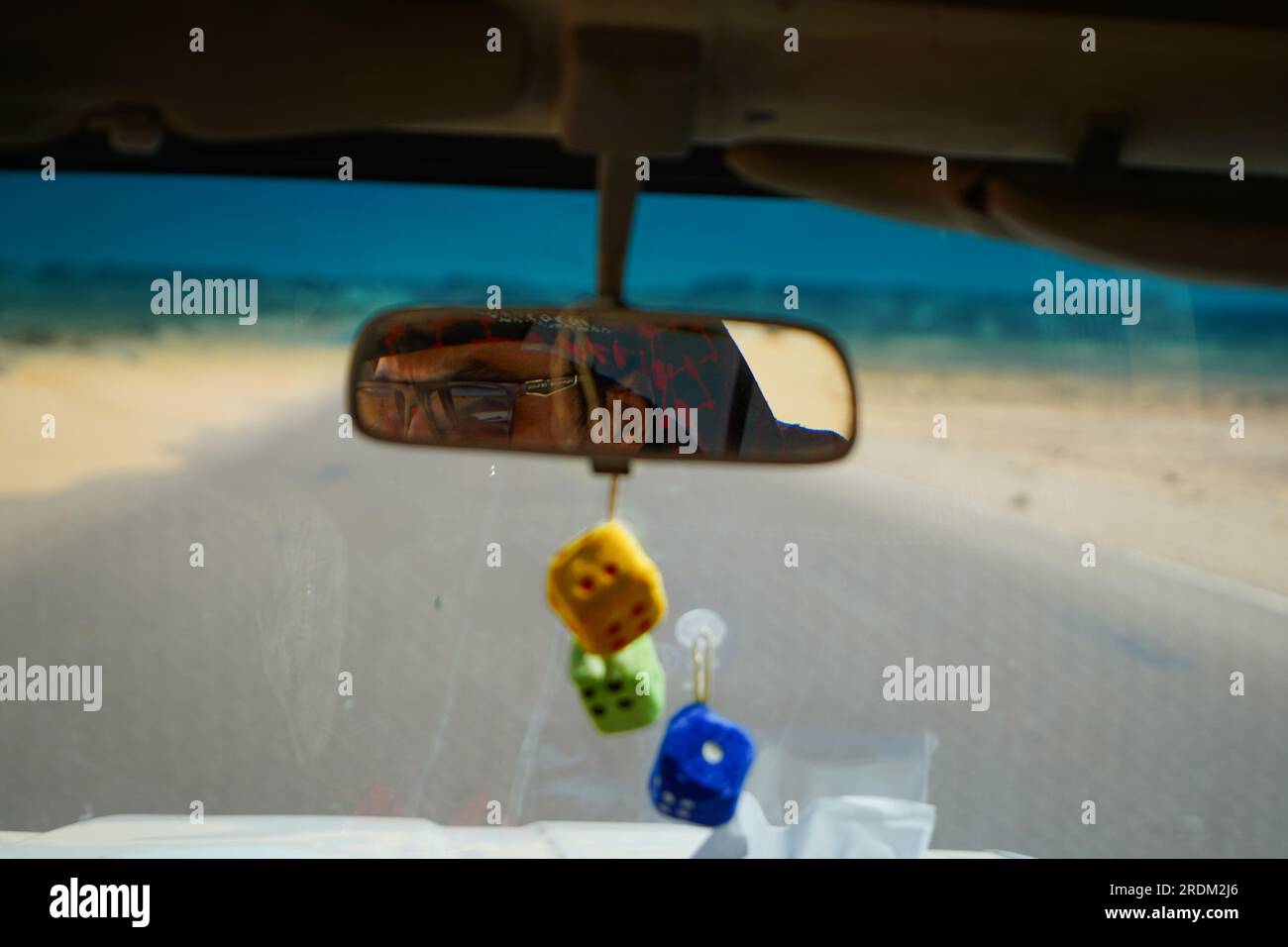 A tour guide seen driving a vehicle en route to the Black Desert, where ...