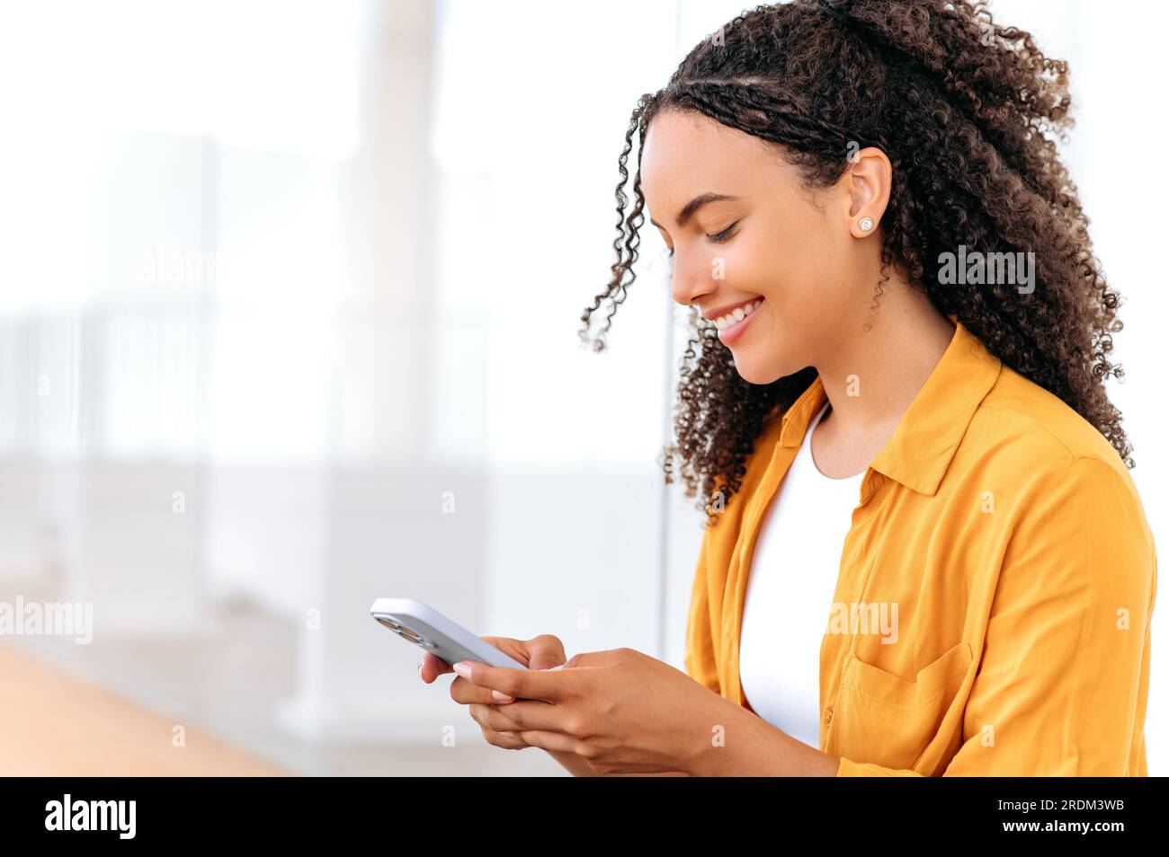 African american woman happily uses hi-res stock photography and images ...