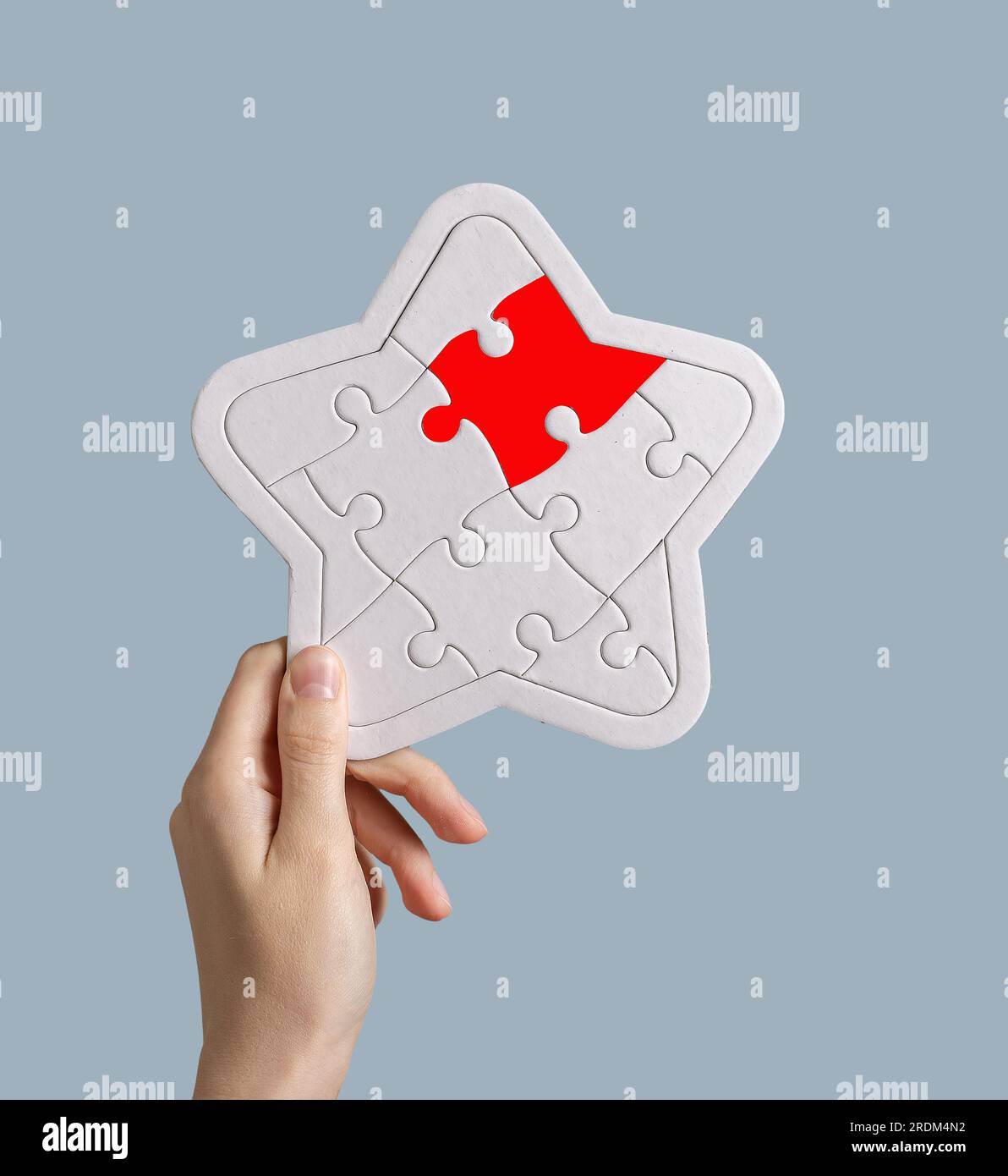 Hand holding star shaped puzzle. Clients ranking, customers rating ...