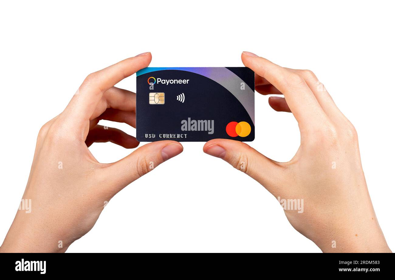 Payoneer card in hands isolated on white background Stock Photo - Alamy