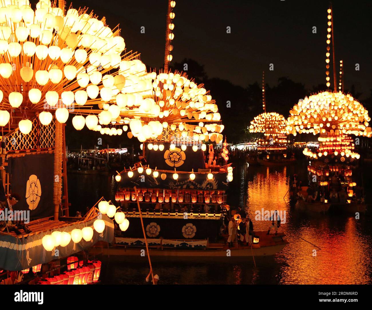 Floating boats decorated with lanterns spot on the Tenno River during ...