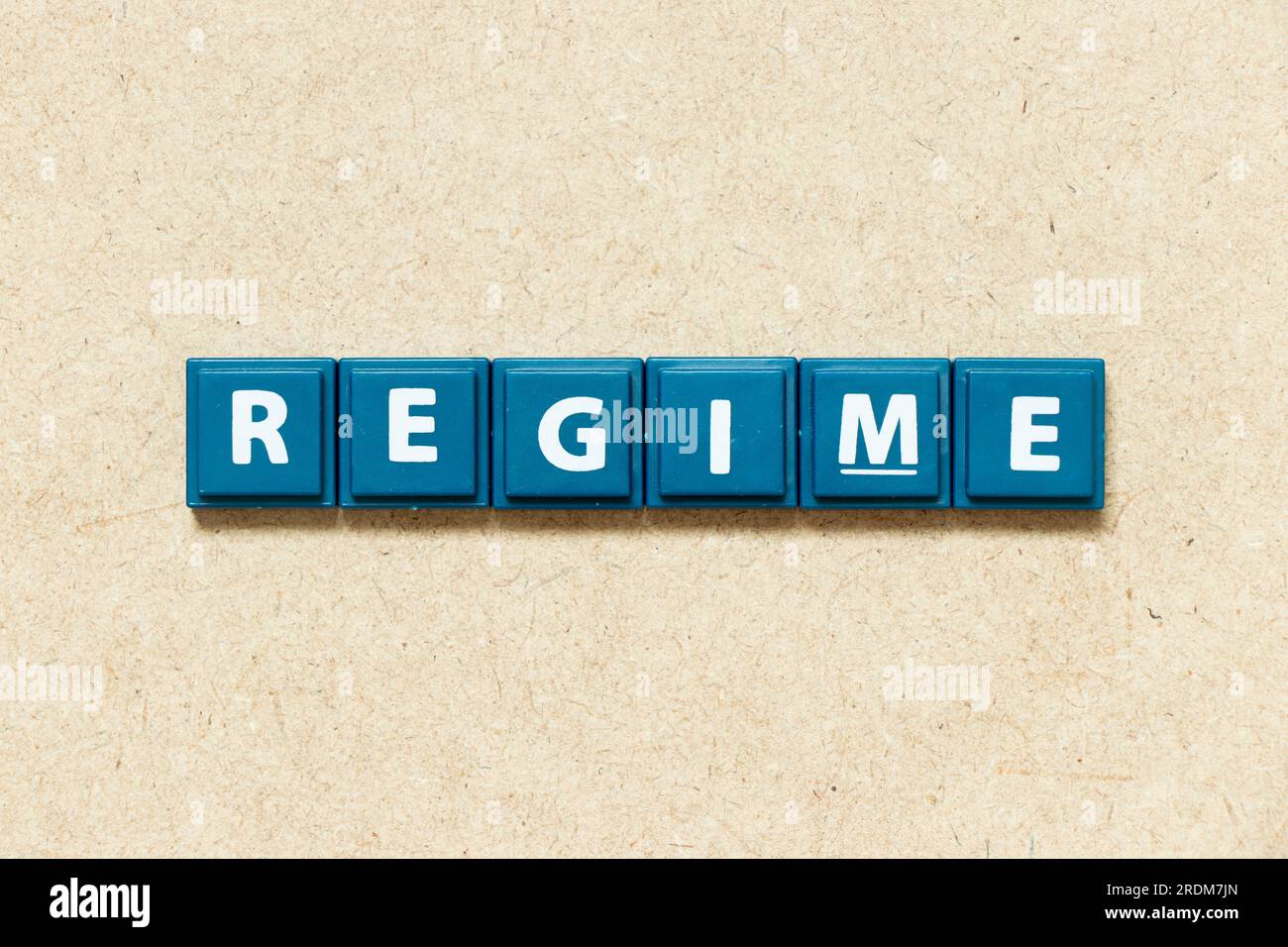 Tile alphabet letter in word regime on wood background Stock Photo - Alamy