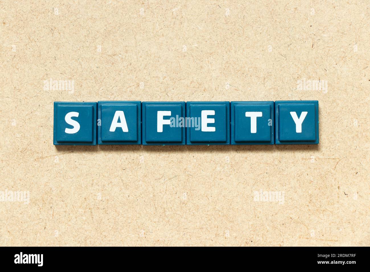 Tile alphabet letter in word safety on wood background Stock Photo - Alamy