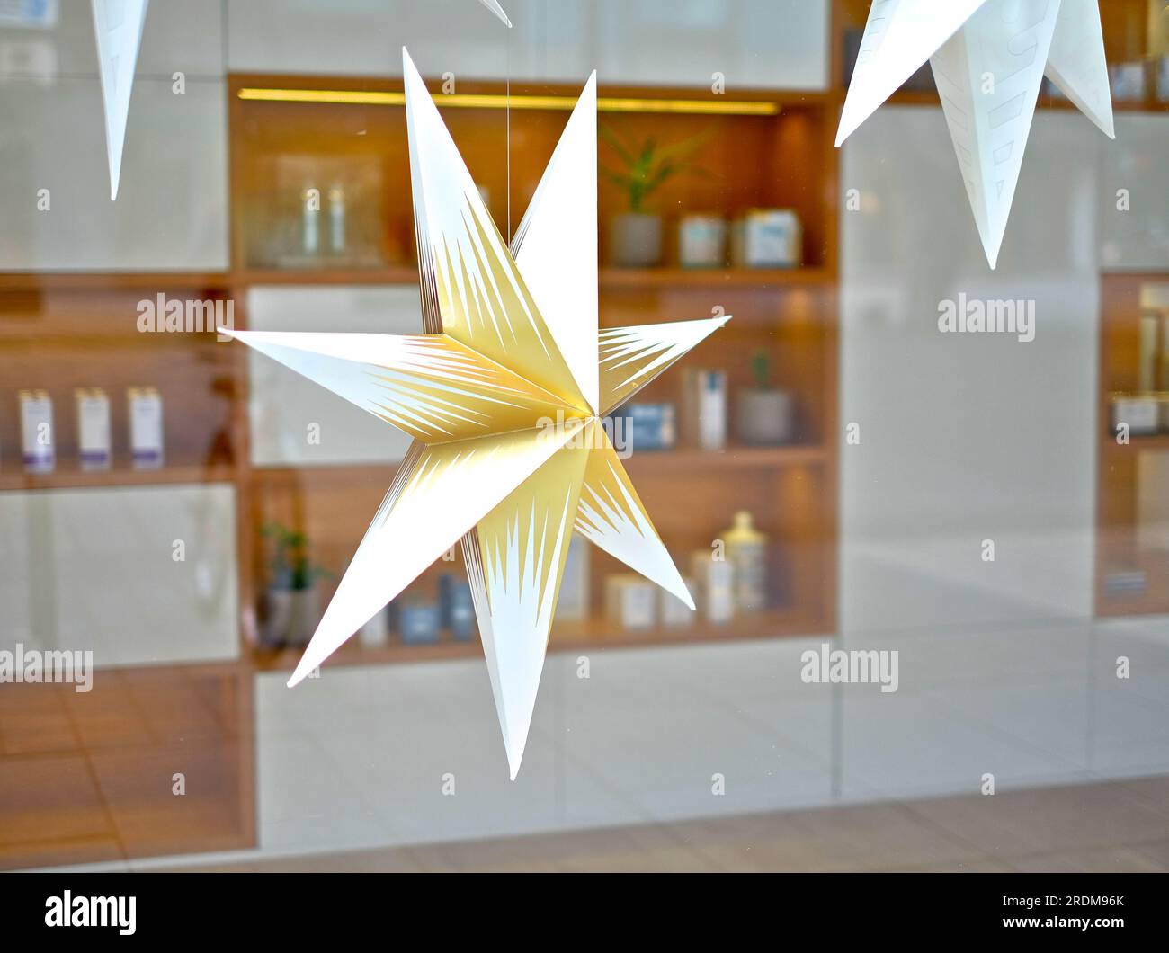 Beautiful golden and white Christmas star, winter decorations in a ...