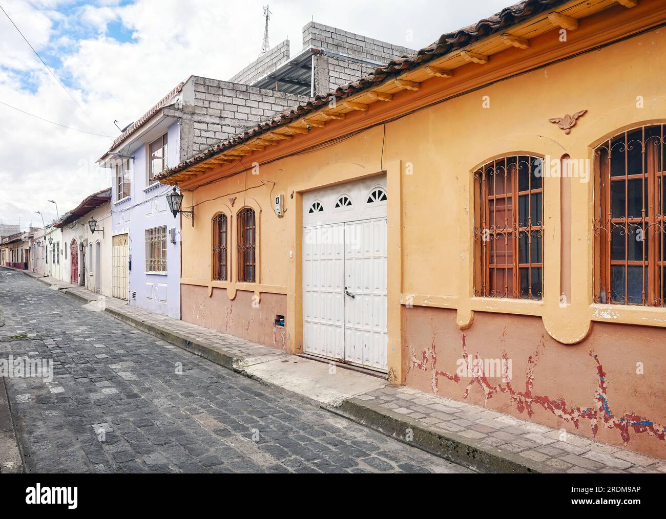 Street of Latacunga town paved with cobblestone, Ecuador Stock Photo ...