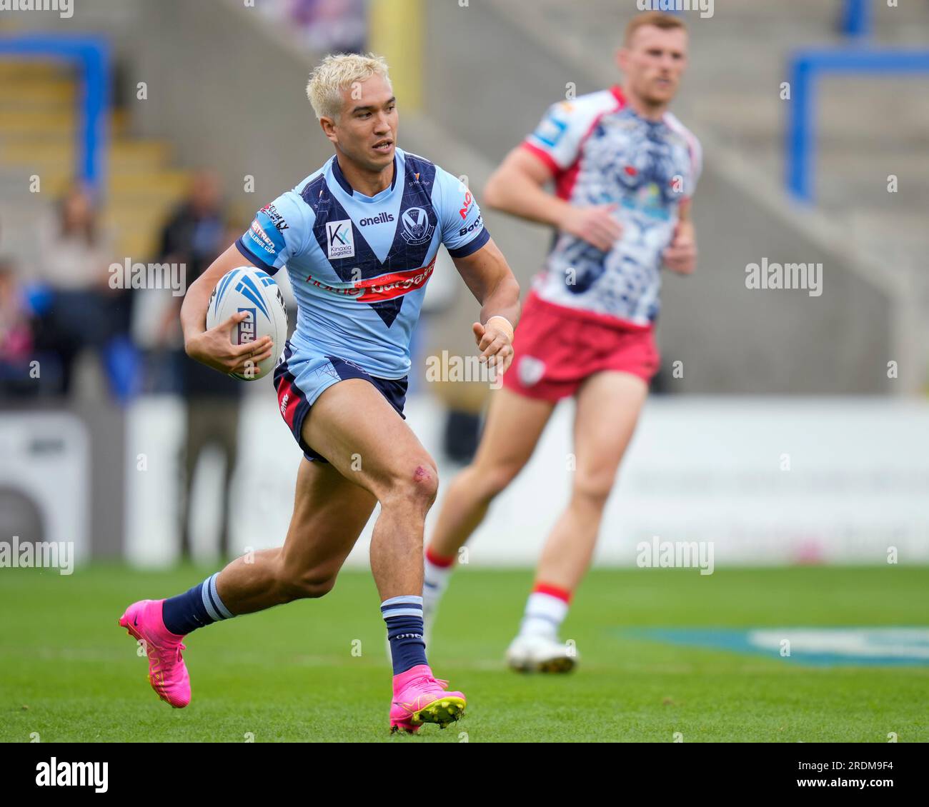 Tee Ritson #25 of St. Helens makes a break during the Betfred Challenge ...