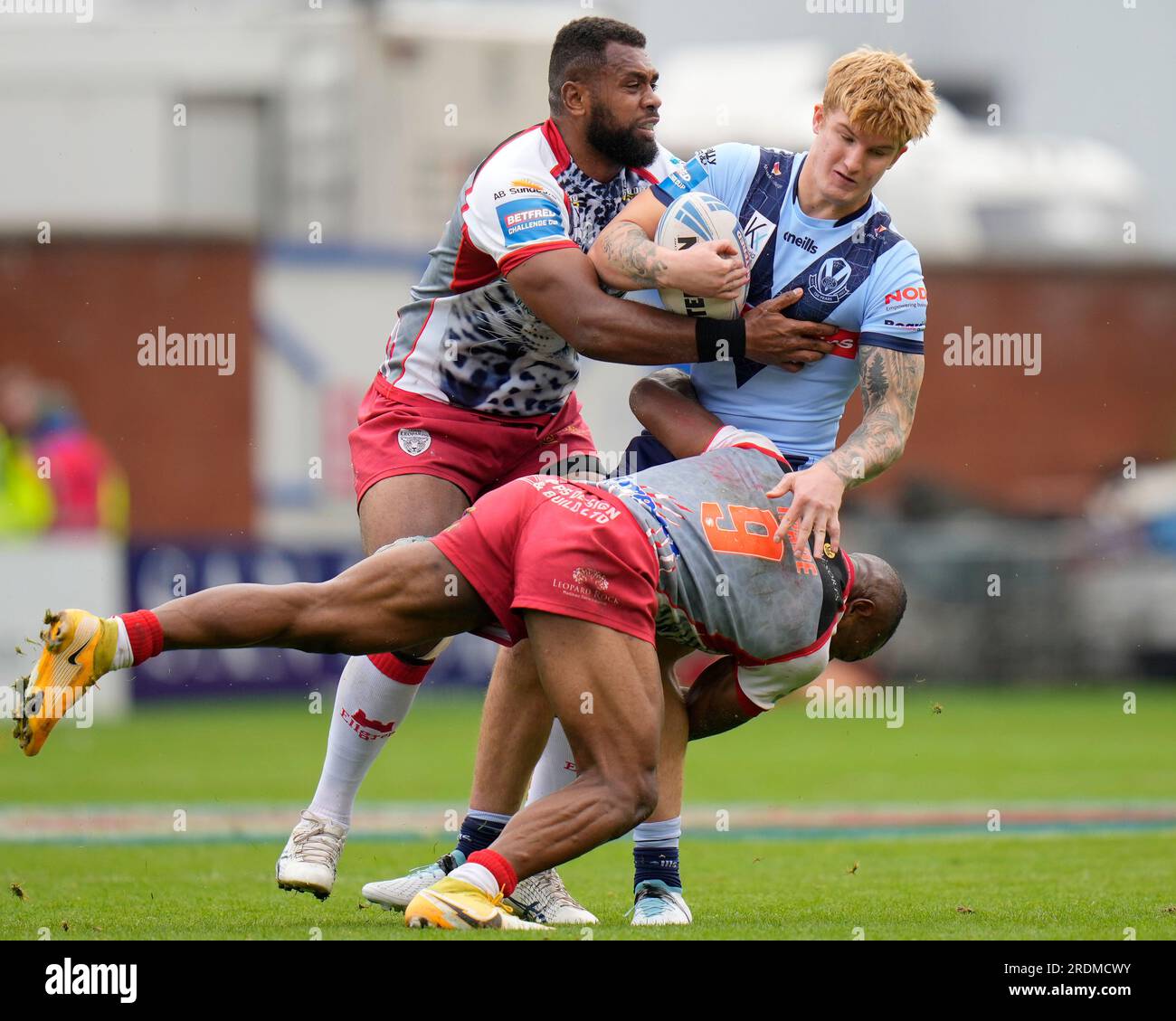 Edwin Ipape #9 of Leigh Leopards tackles George Delaney #30 of St ...