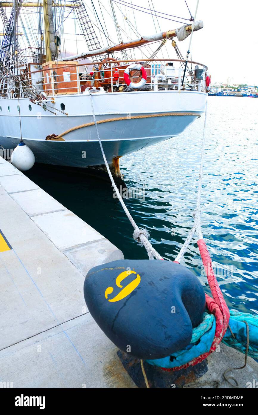 Stern detail of a classic white tall sailing ship docked in a harbour ...