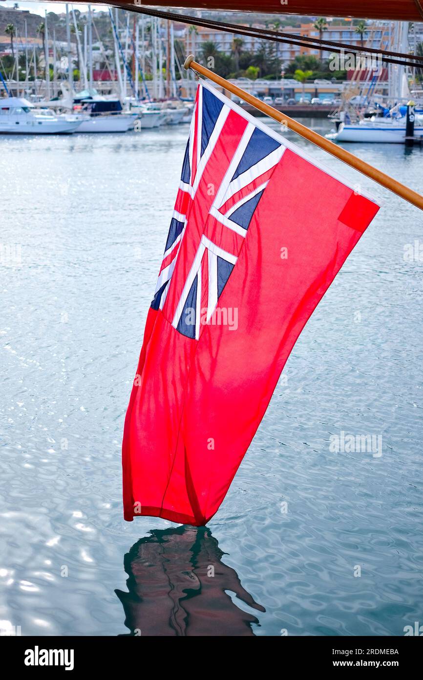The red ensign, a British national flag displayed on the stern of a big ...