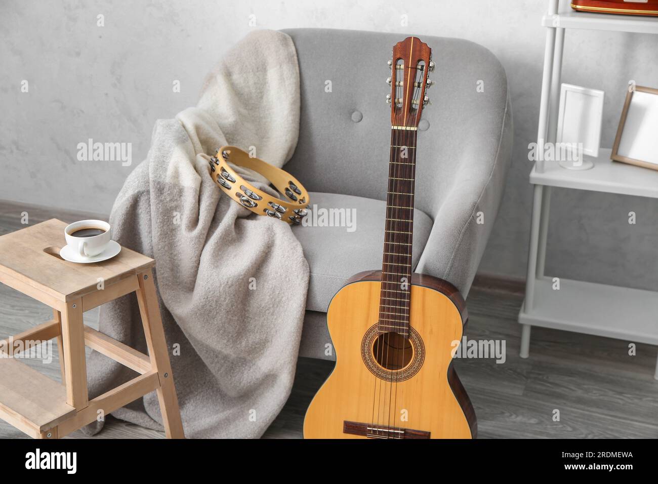 Interior of room with armchair and musical instruments Stock Photo - Alamy