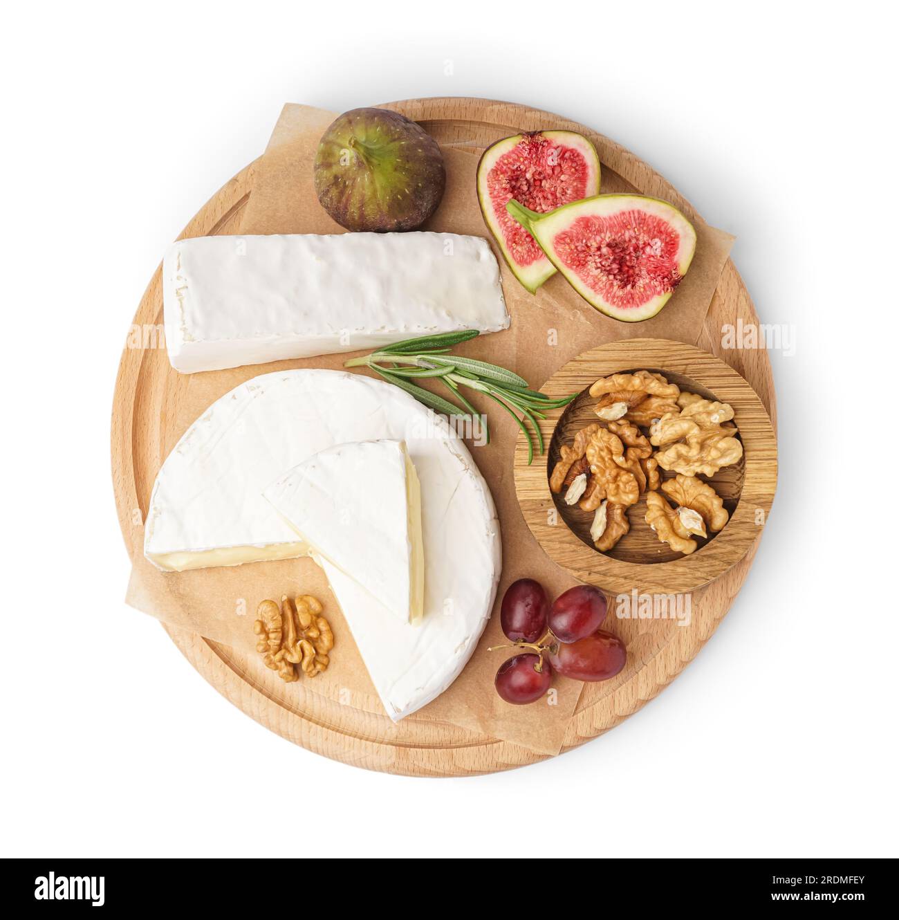 Wooden Board with pieces of tasty Camembert cheese on white background ...