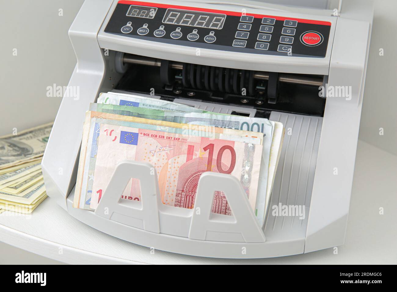 Euro bills calculating electronic counter hi-res stock photography and ...