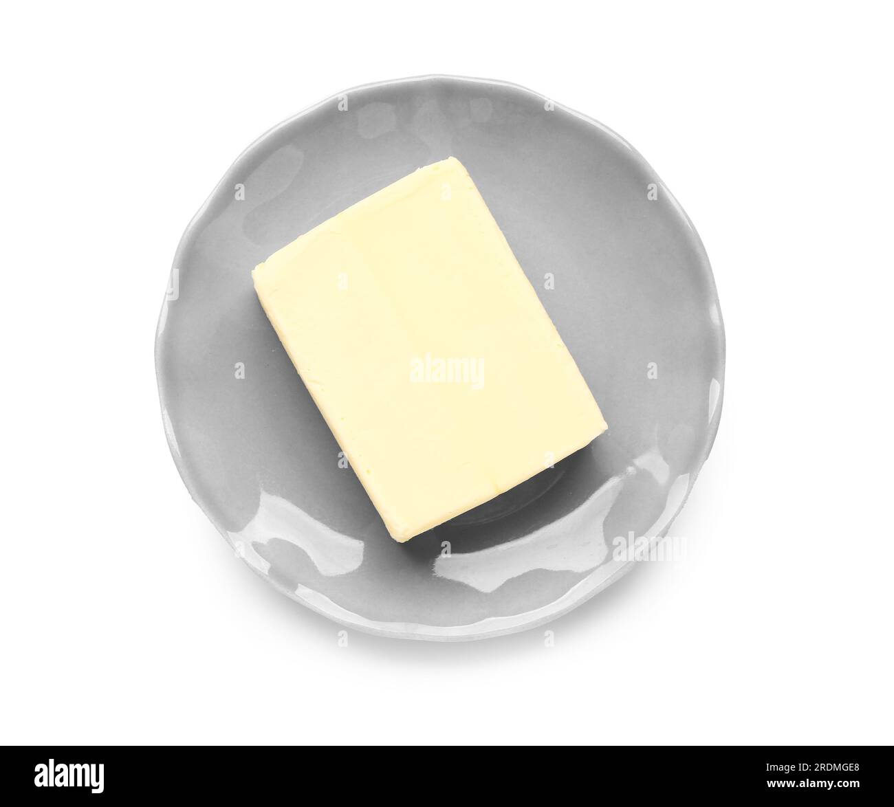 Plate with fresh butter on white background Stock Photo - Alamy