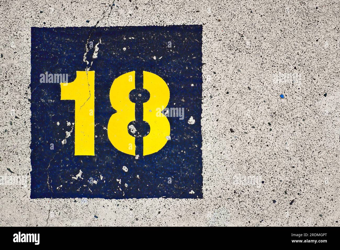 Number 18, eighteen, yellow and blue on gray background Stock Photo - Alamy