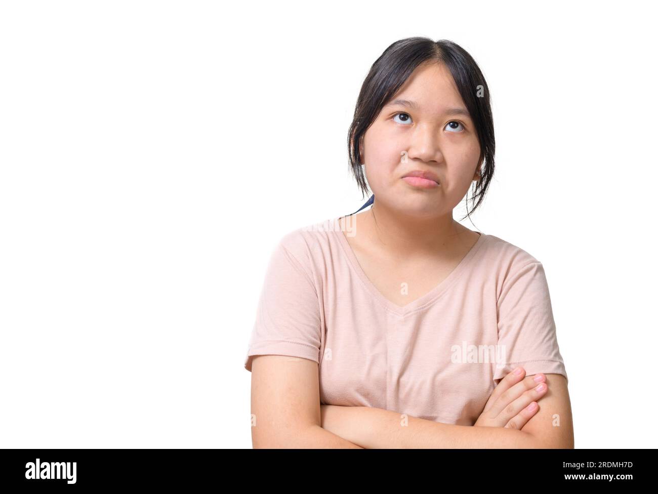 Asian girl feel bored and stand with her arms crossed isolated on white ...