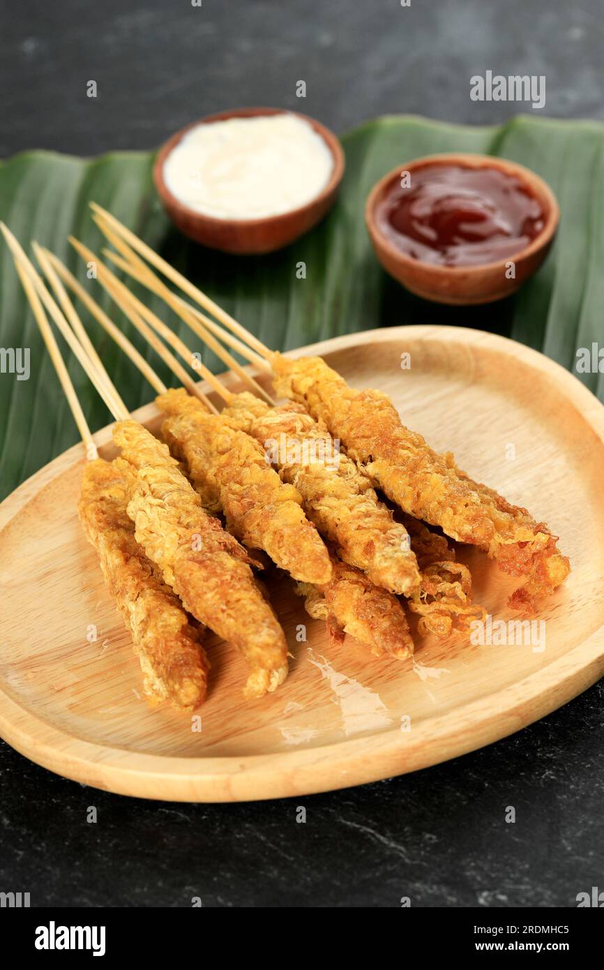 Telur or Telor Gulung, Rolled Egg Omelette with Skewers. Popular Street ...