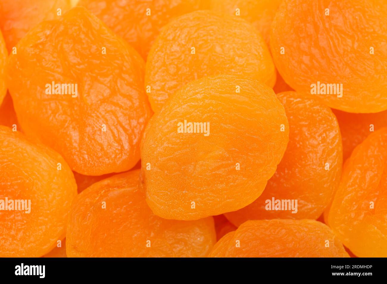 Texture of tasty dried apricots as background Stock Photo - Alamy
