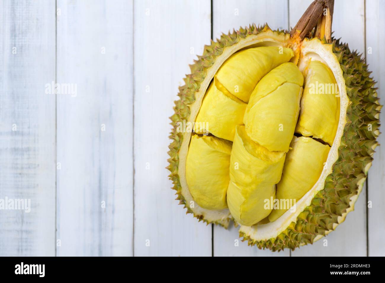 top view of Durian fruit. Ripe monthong durian on white wood background, king of fruit from ...