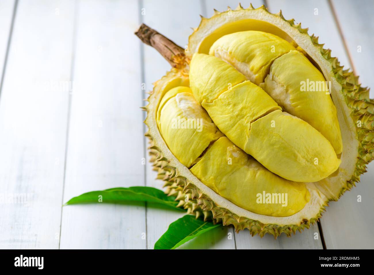 Durian fruit. Ripe monthong durian on white wood background, king of fruit from Thailand on ...