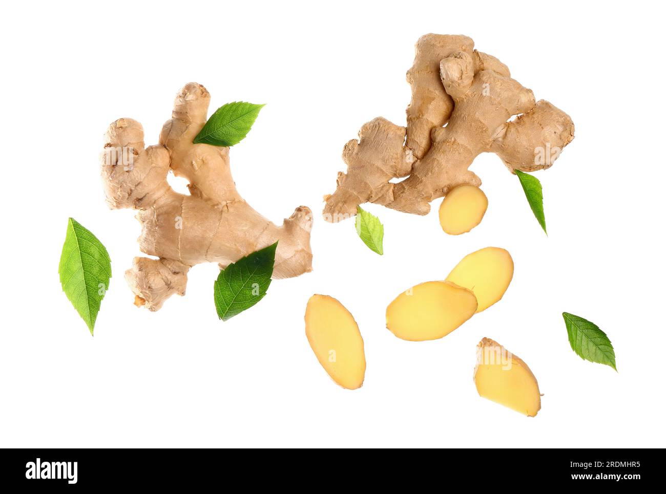 Flying fresh ginger roots and leaves on white background Stock Photo ...