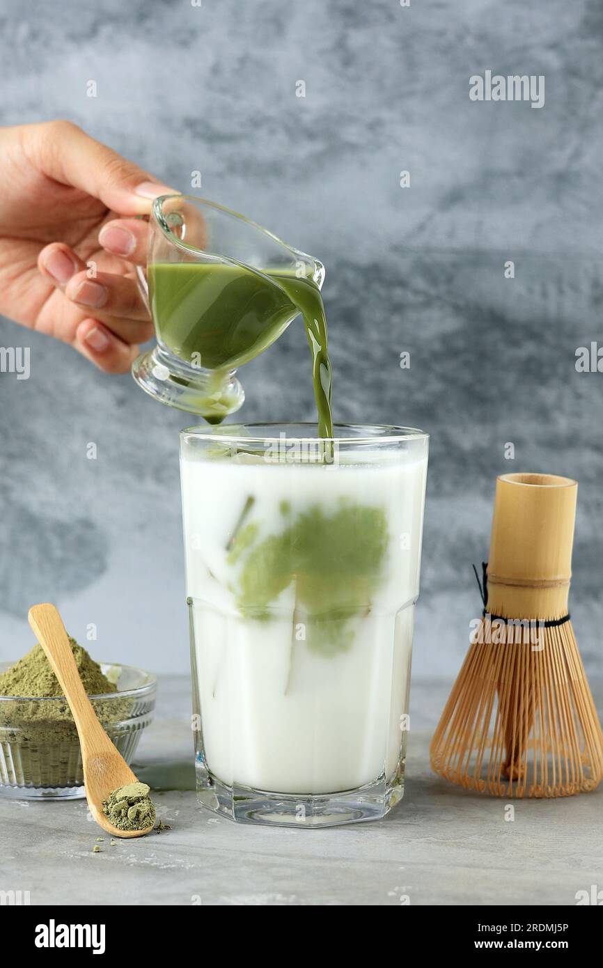 Pouring milk green matcha iced hi-res stock photography and images - Alamy