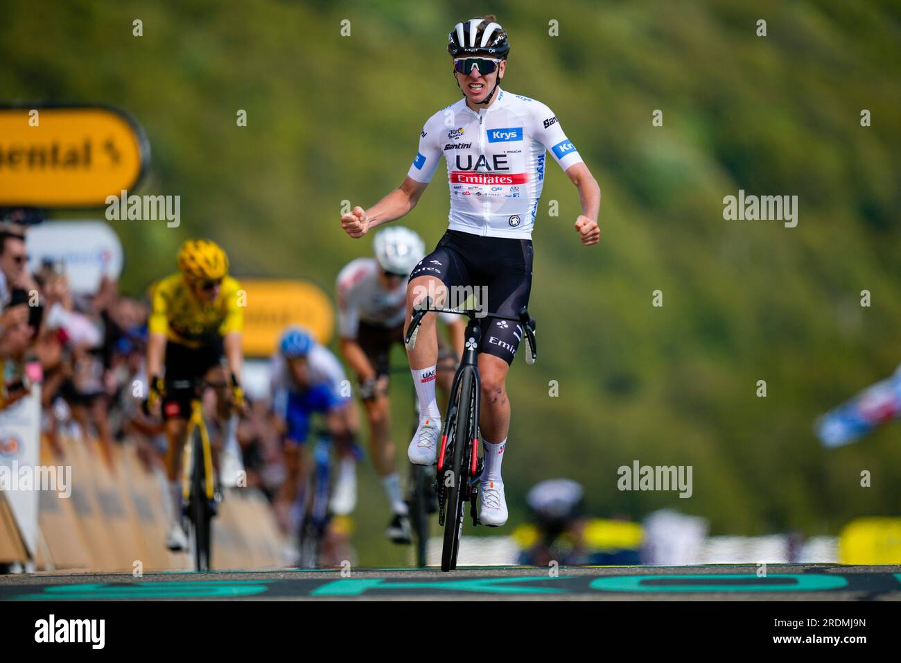 Slovenia's Tadej Pogacar, wearing the best young rider's white jersey ...