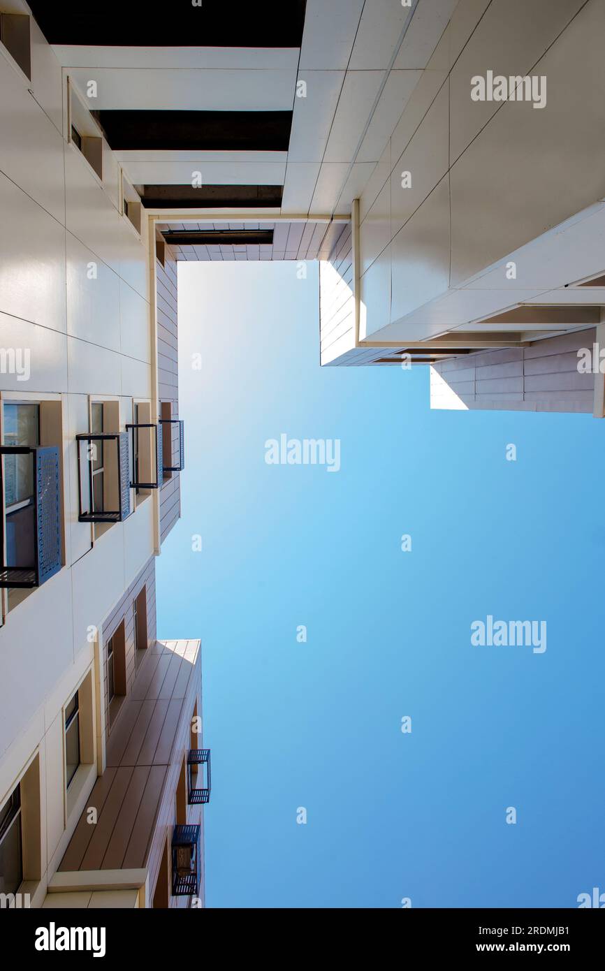 Exterior of a new multi-storey building. Angle from below on the view ...