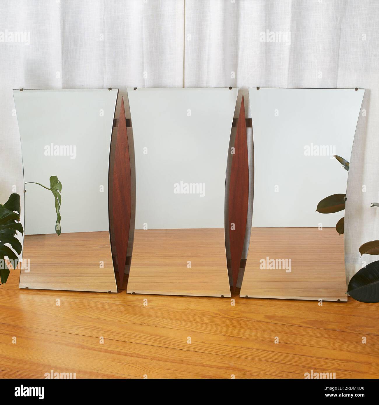Three tapered mirrors. Mid-Century Modern home decor Stock Photo - Alamy