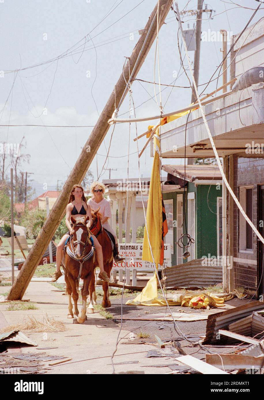 Rebecca Reeder, foreground, and Naomi Bollag, ride horses down the main ...