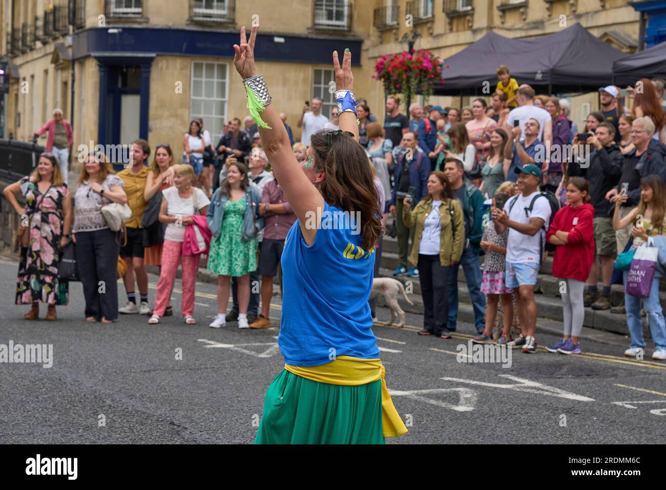 Dancers and musicians dressed in ornate costumes parade through the ...