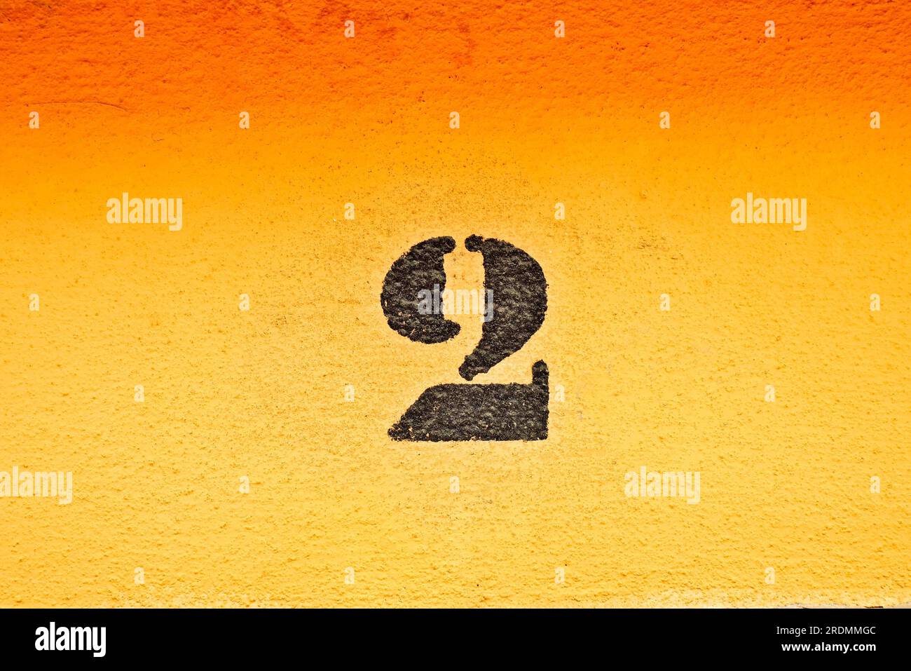 2, number two, black digits on graduated orange / saturated yellow ...