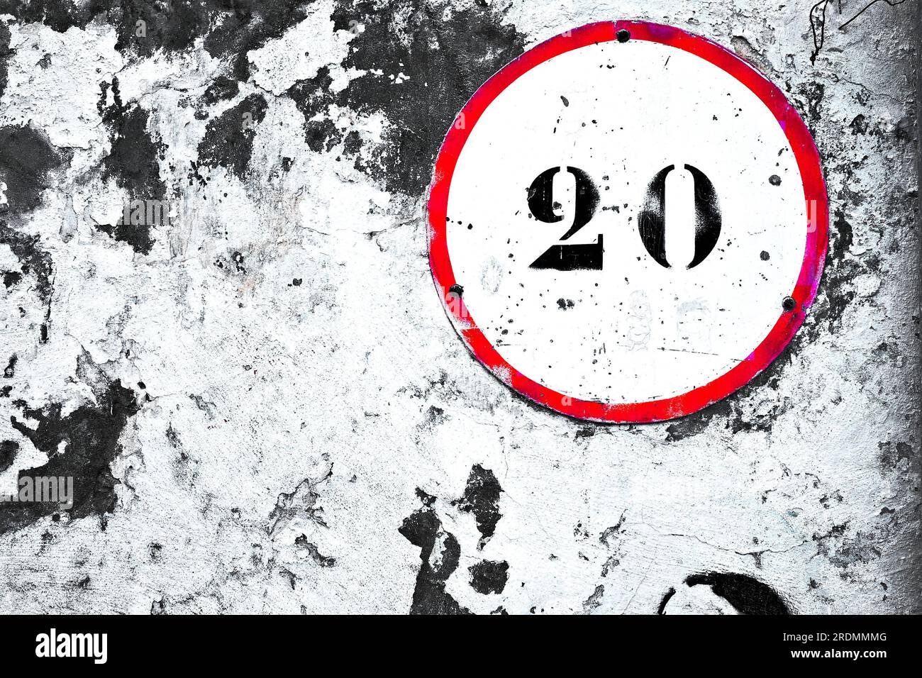 Number 20, twenty, old speed limit sign on a wethered grungy wall Stock ...