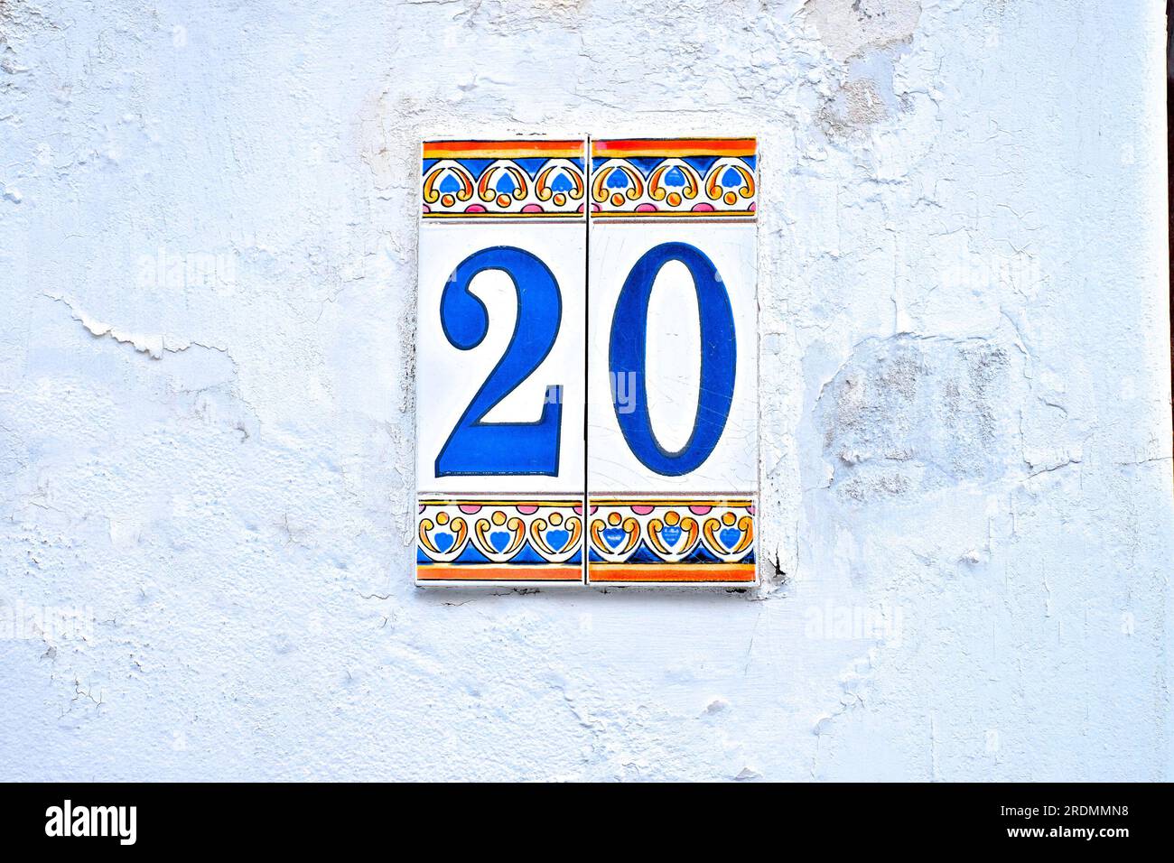 Number 20, twenty, old colorful tiles on white aged wall Stock Photo ...