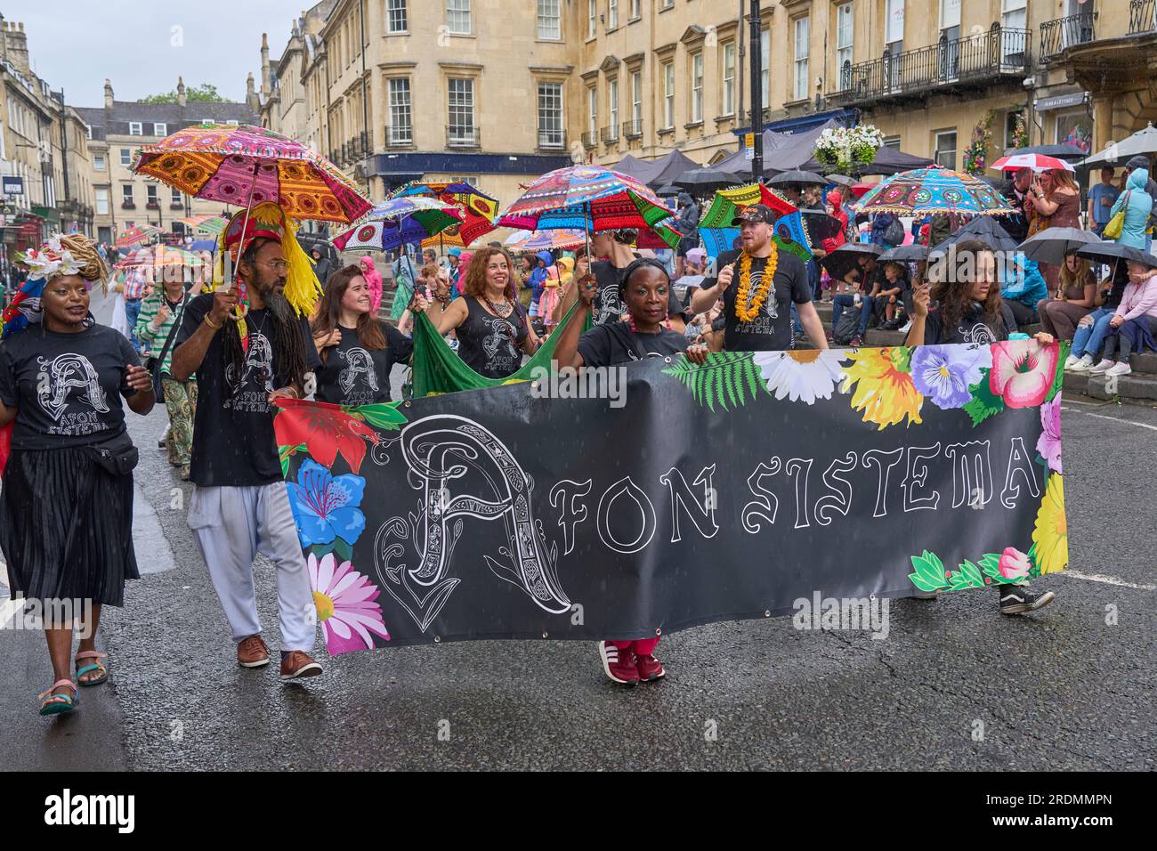 Dancers and musicians dressed in ornate costumes parade through the ...