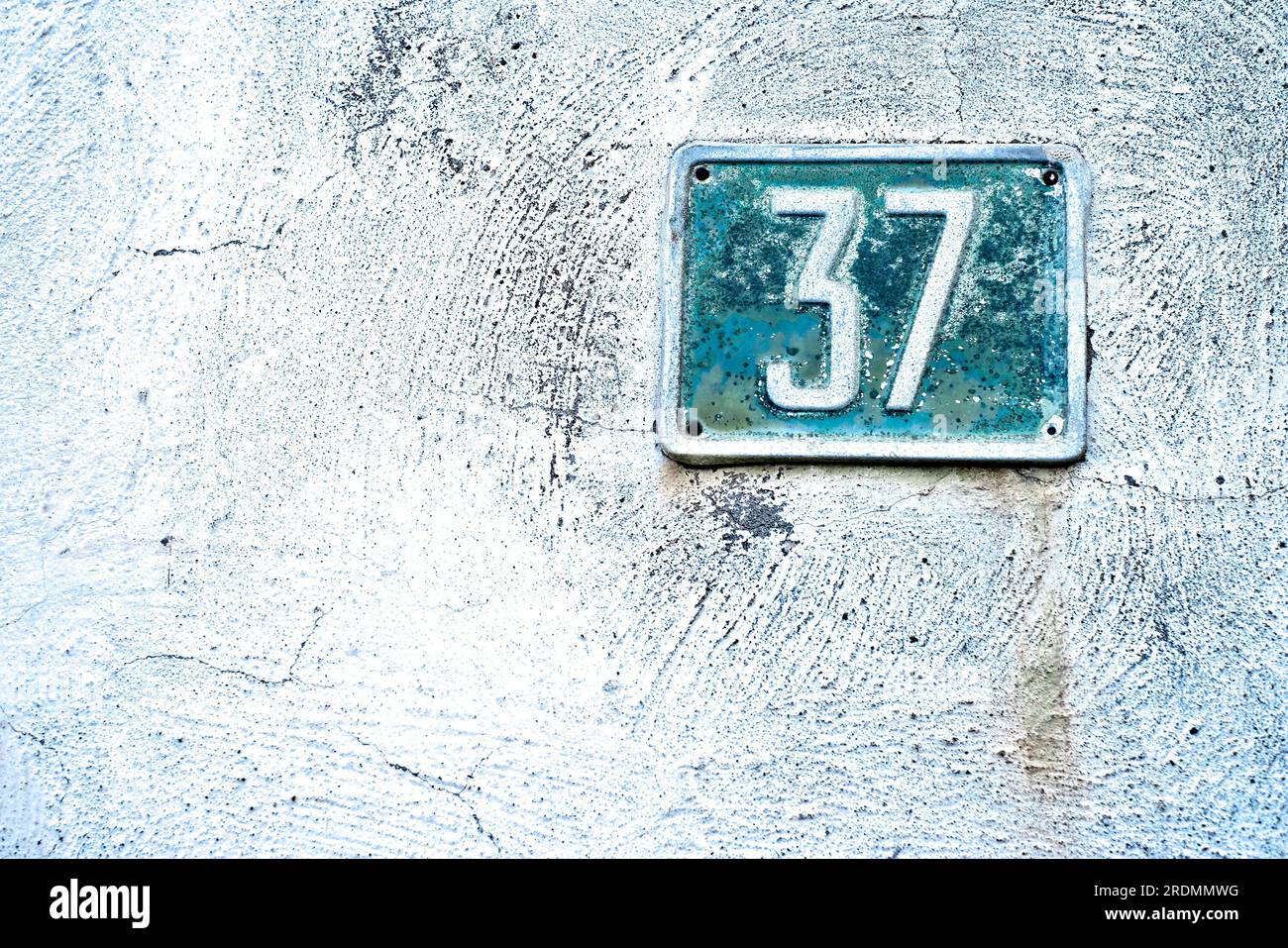 Number 37, thirty-seven, blue blate on frottage white background Stock ...