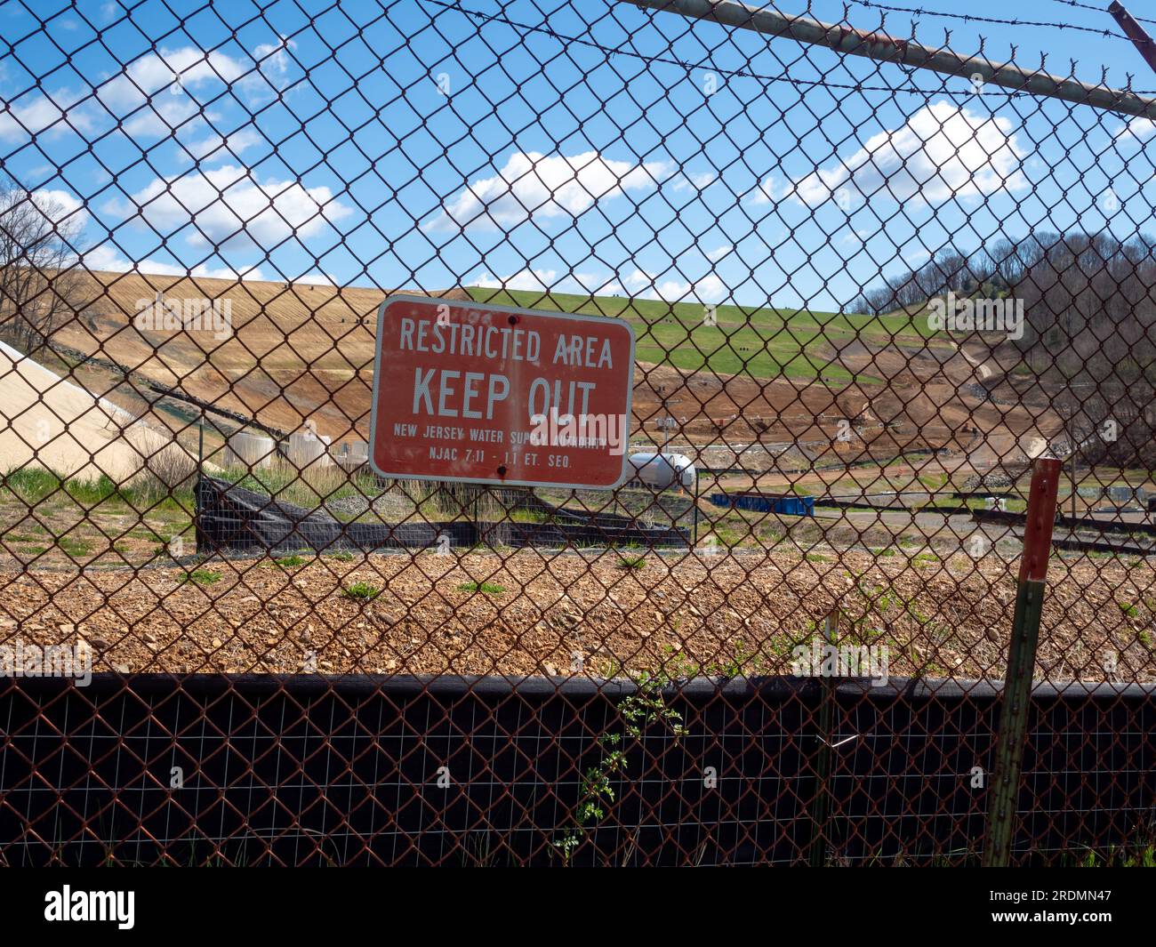 fence and sing on Central New Jersey water reservoir Stock Photo - Alamy