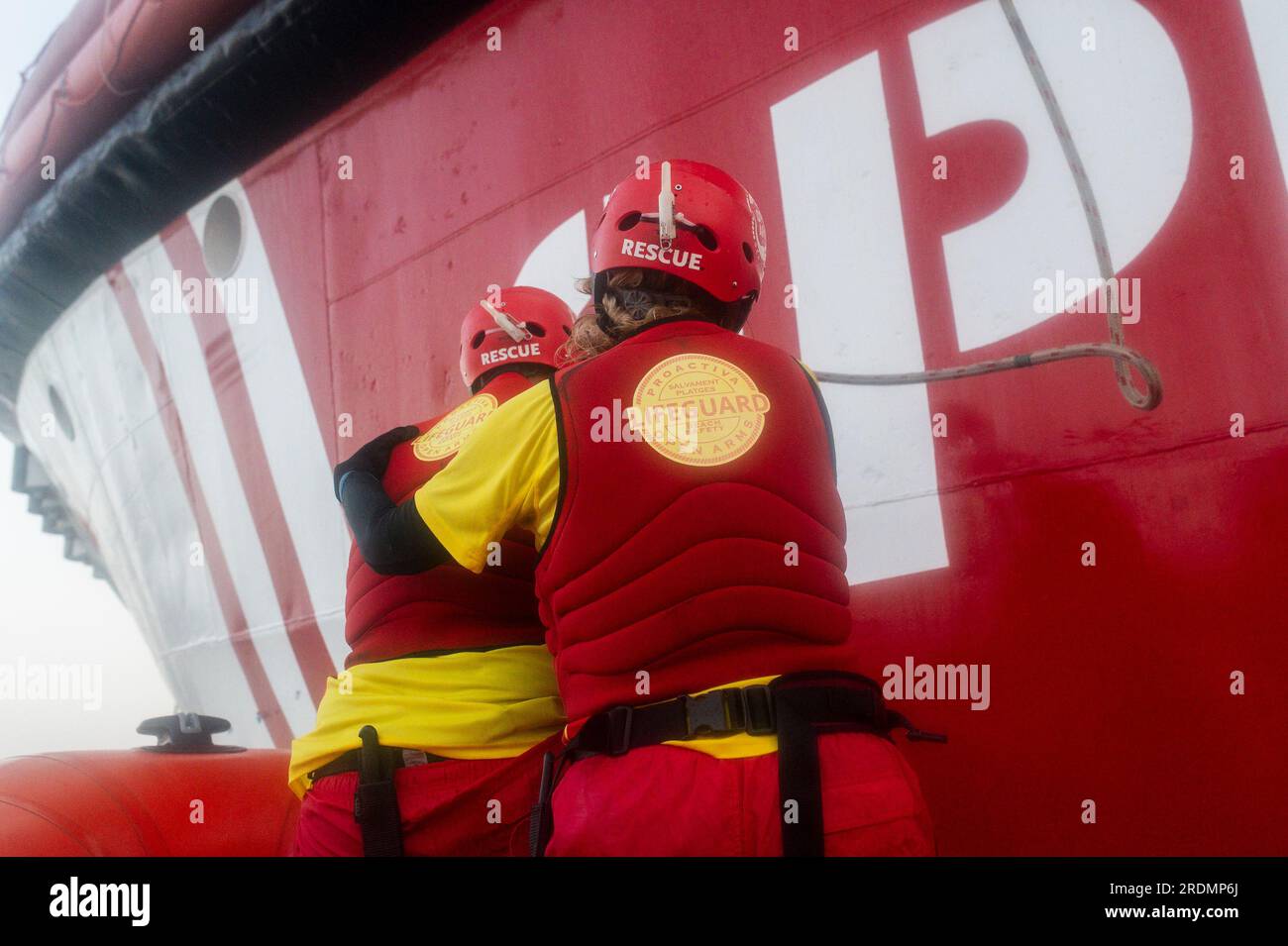Two rescuers of the Open Arms seen during an exercise. Rescuers on ...