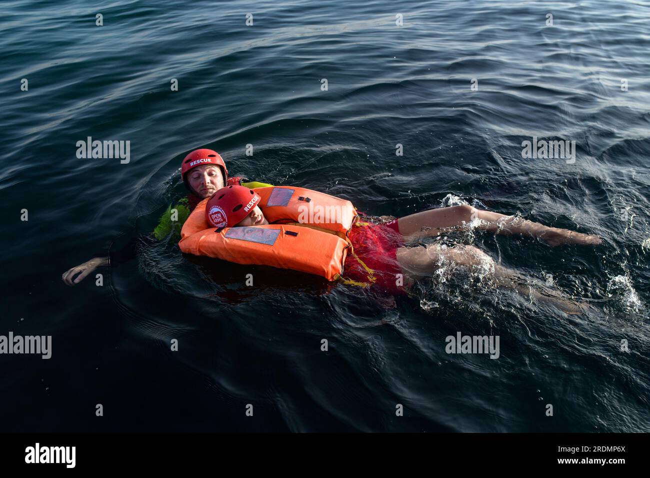 Rescuers of the Open Arms seen during an exercise. Rescuers on board of ...