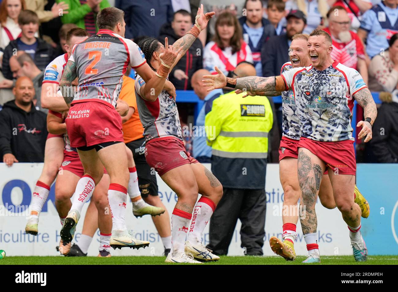 Josh Charnley #5 of Leigh Leopards celebrates with Tom Amone #8 of ...
