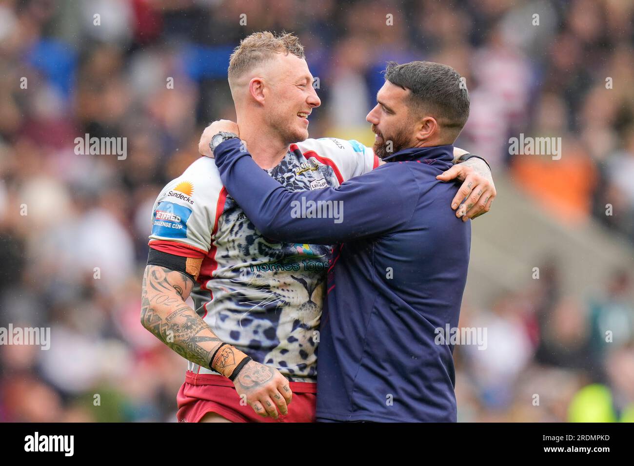 Josh Charnley #5 of Leigh Leopards commiserates with Saints coach and ...