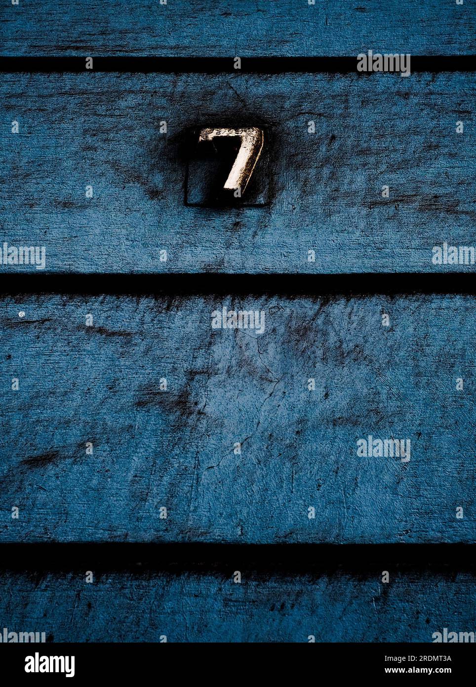 Number 7, seven, in dark subdued vintage blue background, offset with ...