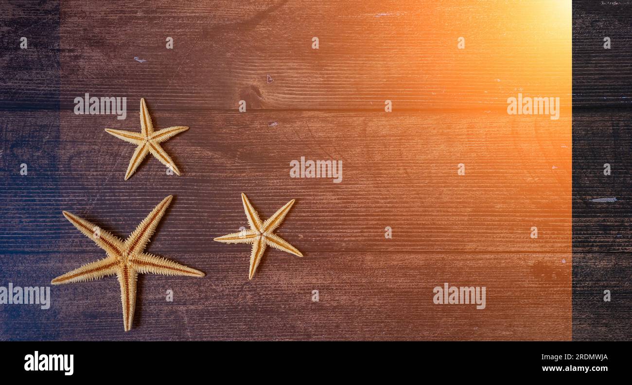 Sea stars. Summer nautical background - stars on wooden background ...