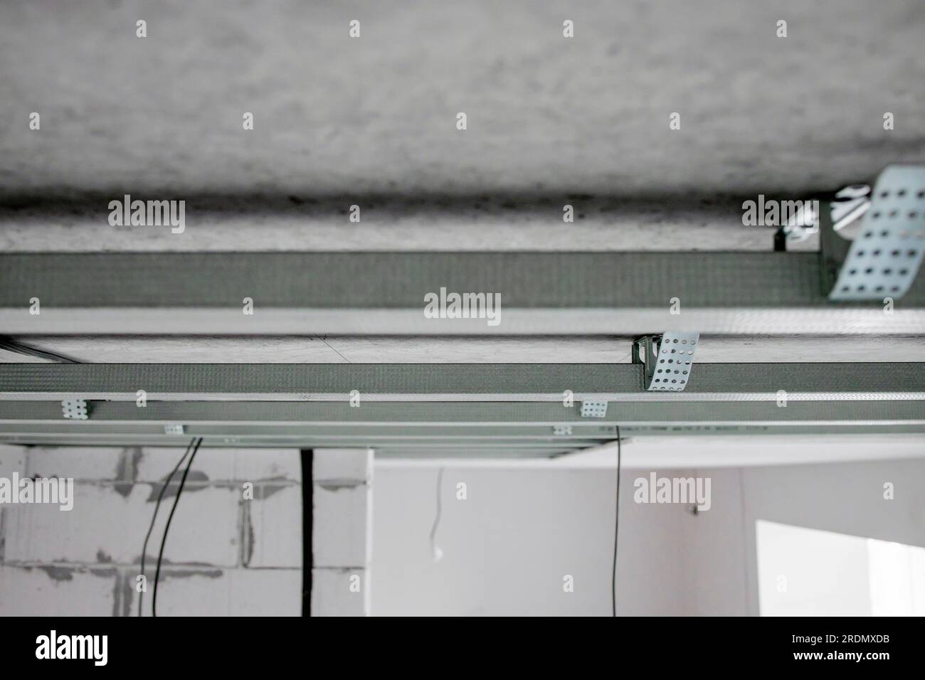 Suspended ceiling structure with profiles for installation of ceiling ...