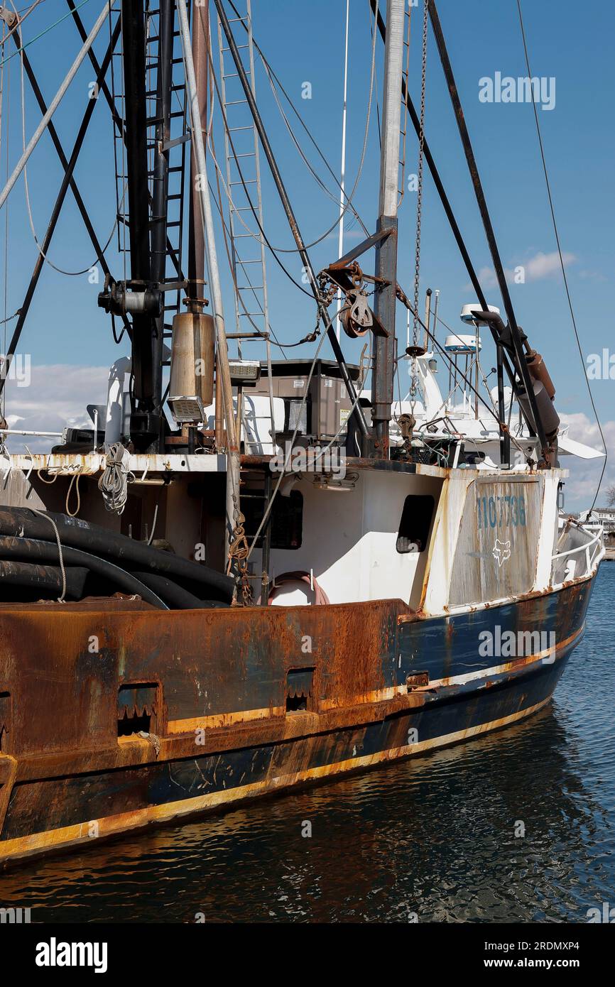 Fishing boats line up in Hyannis Harbor next to Bismore Park. Summer is ...