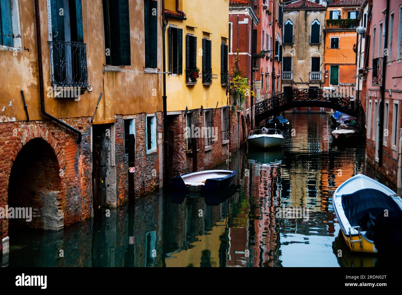 Brick canal boat portal and reflections in Venice, Italy Stock Photo ...