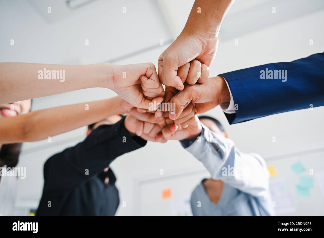 Professional group of business team stacking hands together with ...