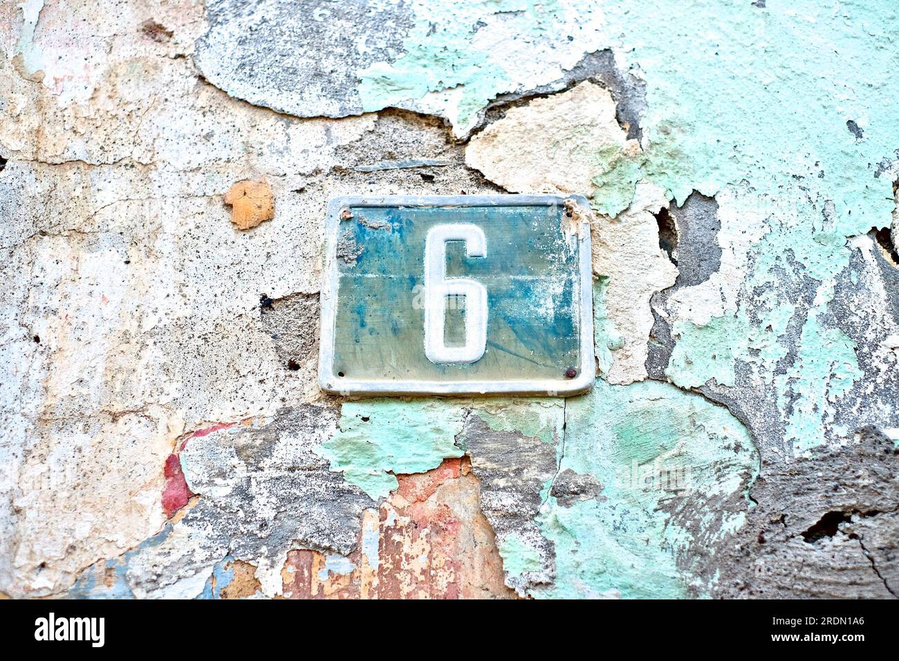 Number 6, six, vintage blue plate on a beautiful wethered wall with ...