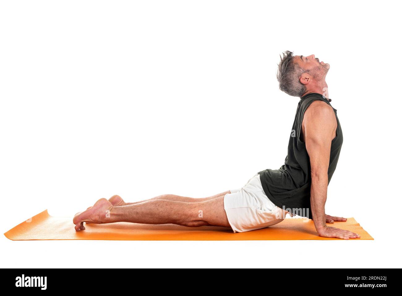 man and hatha yoga asana in front of white background Stock Photo - Alamy